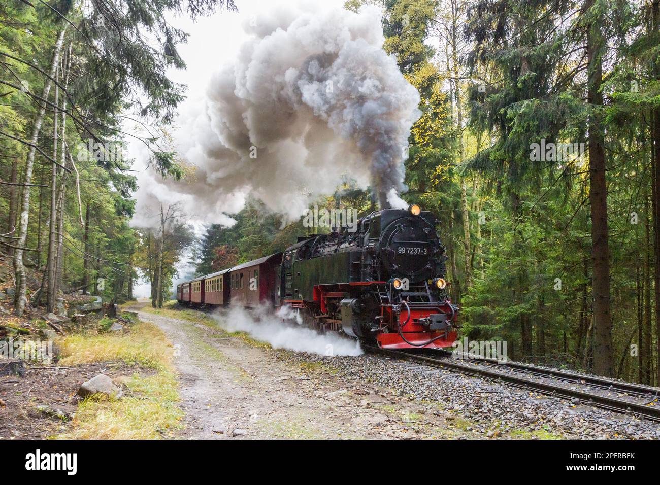 A steam passenger train making its way to the Brocken in the Harz Stock ...