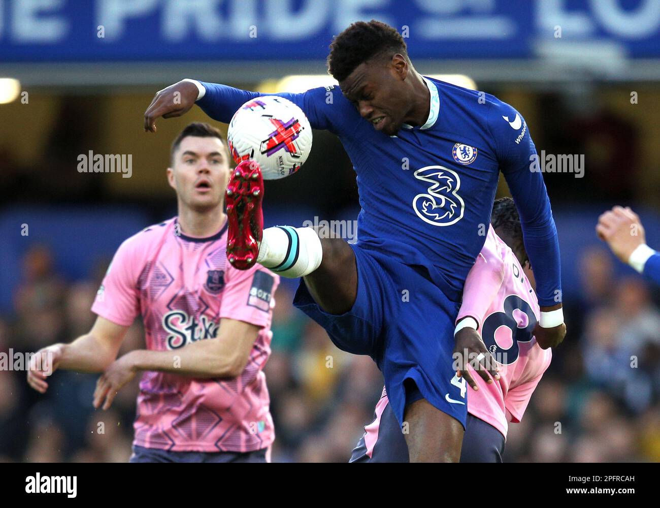 Chelsea's Benoit Badiashile (left) and Everton's Amadou Onana battle ...