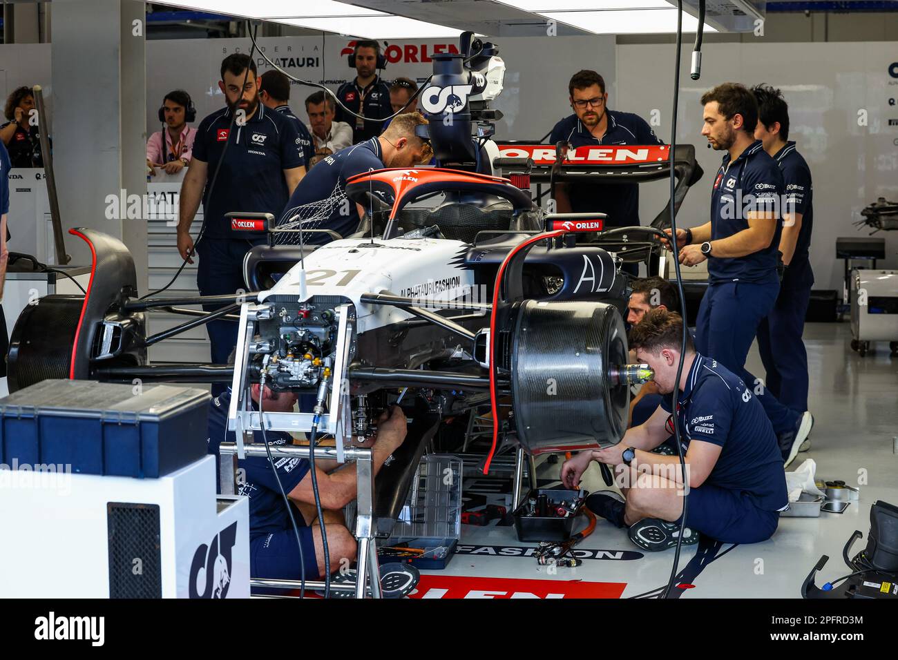 Scuderia AlphaTauri AT04, mechanics working on the car in the garage during the Formula 1 STC ...