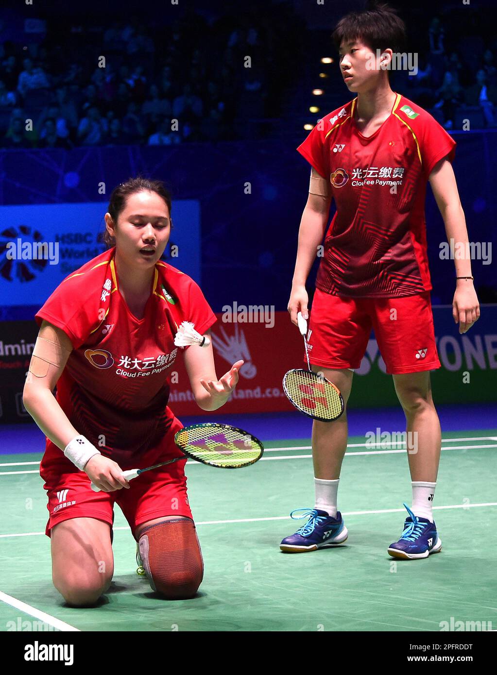 China's Zhang Shu Xian and Zheng Yu, left, react after losing a point during their women's ...