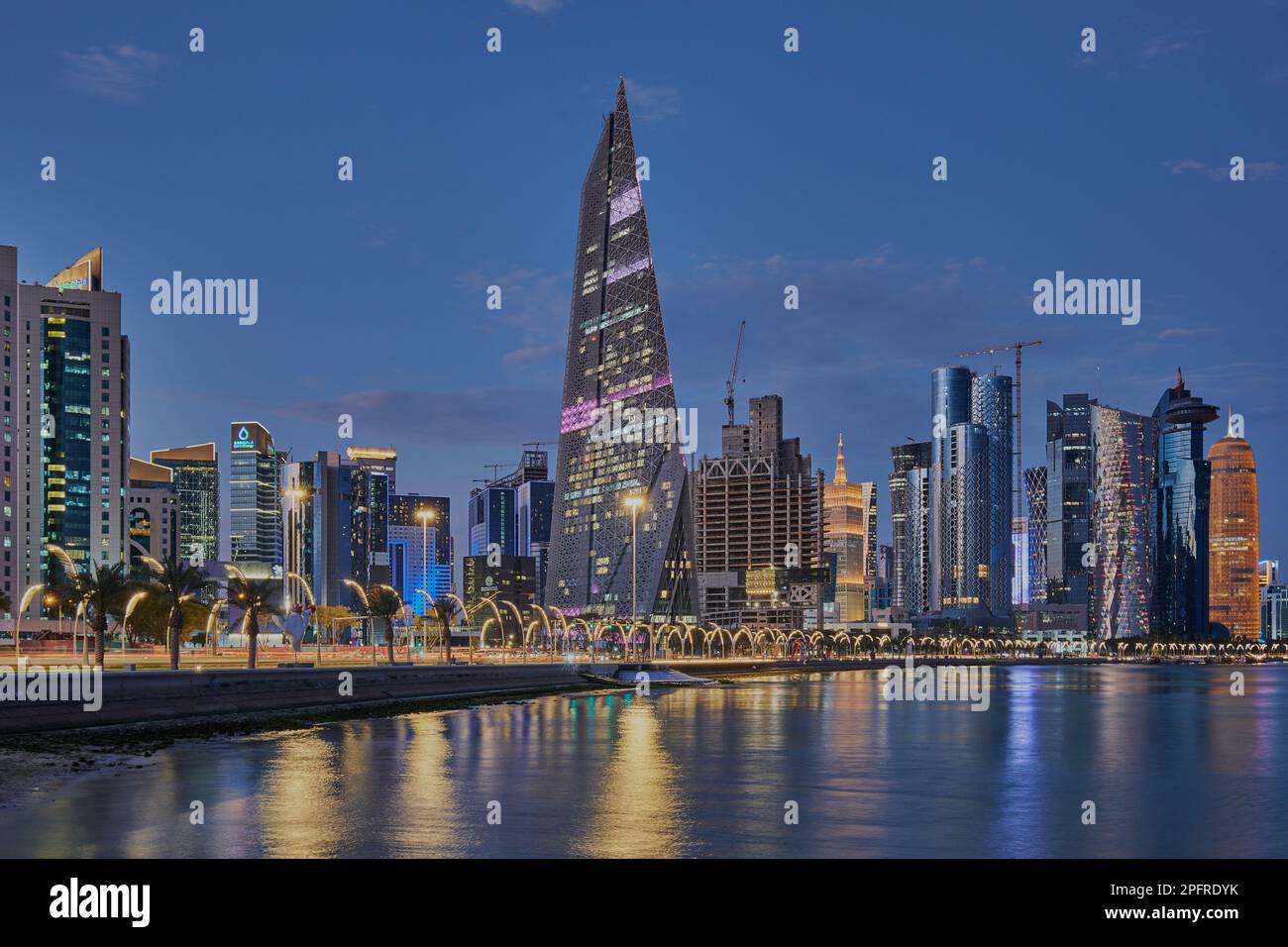 Doha Qatar skyline from corniche promenade at dusk showing West Bay ...