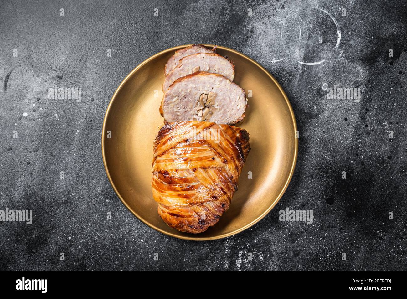 Roasted bacon wrapped meatloaf, sliced mince meat loaf. Black ...