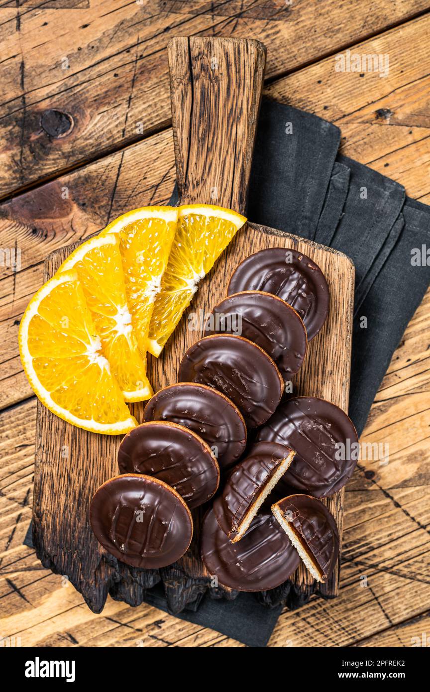 Chocolate Jaffa Cakes with Orange Flavored Marmalade. Wooden background ...