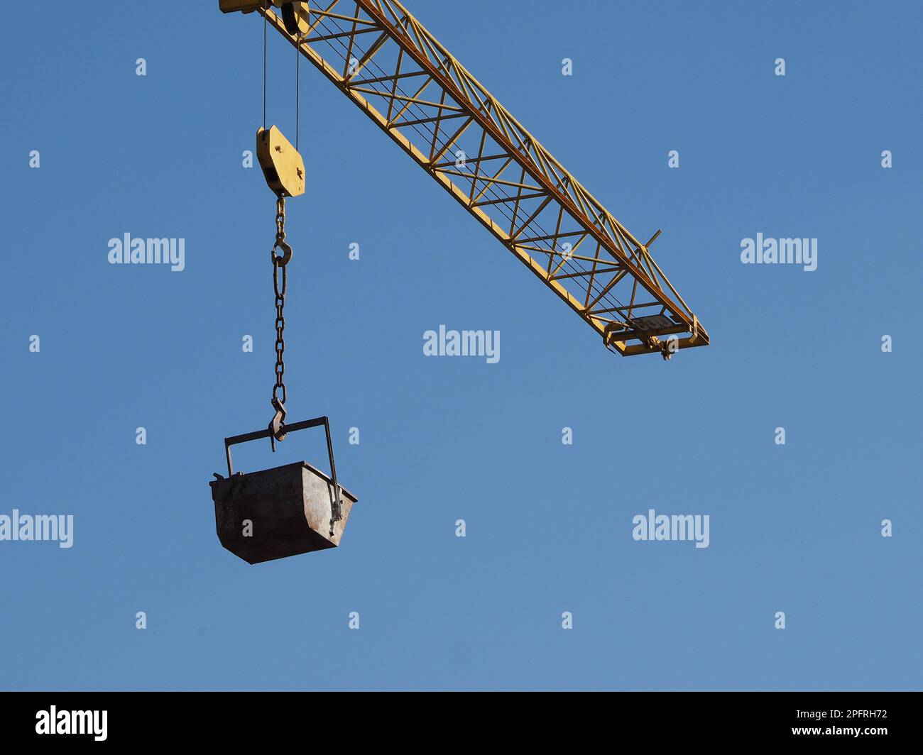 bucket attached to the lifting hook of a crane Stock Photo - Alamy