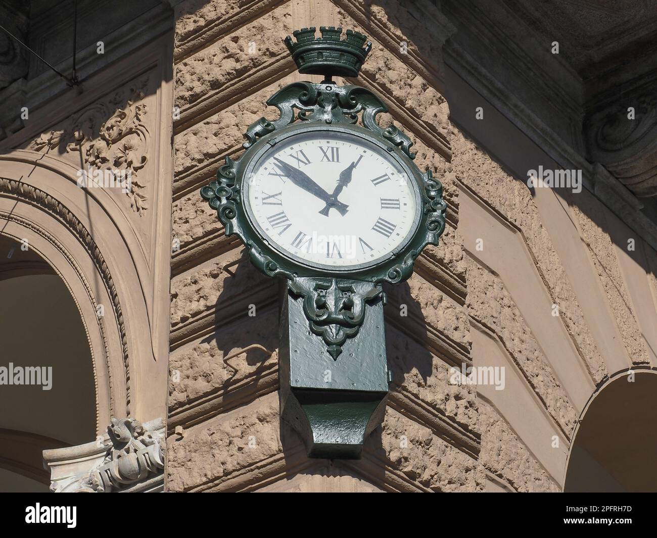 vintage green outdoor wall mounted clock timepiece Stock Photo - Alamy