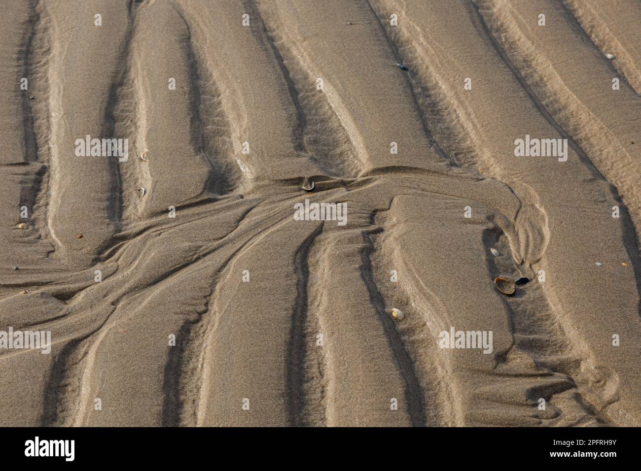 Water on rippled sand on a beach - texture, pattern Stock Photo - Alamy