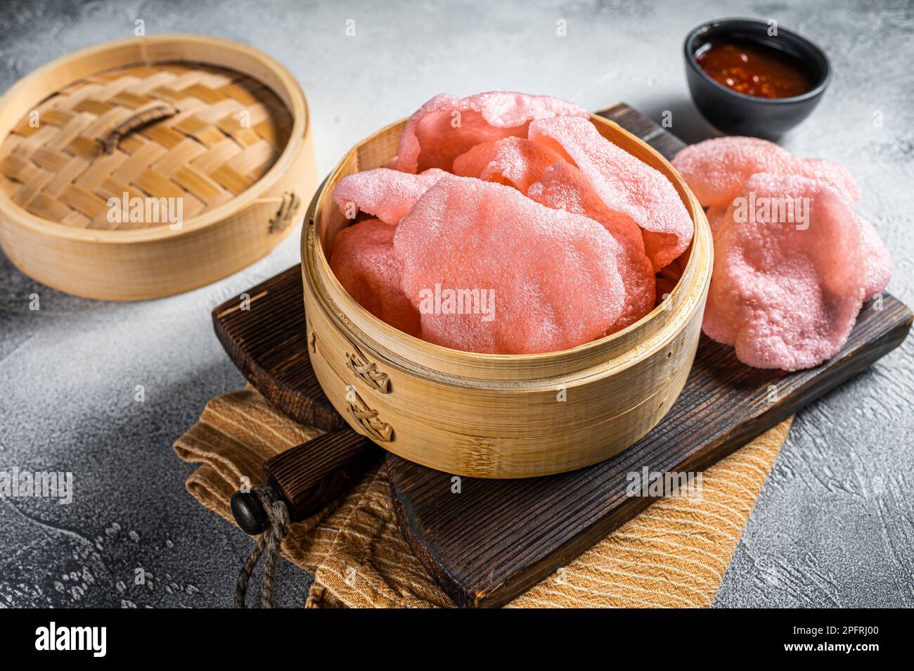 Indonesian prawn shrimp crackers or chips with sauce. White background ...