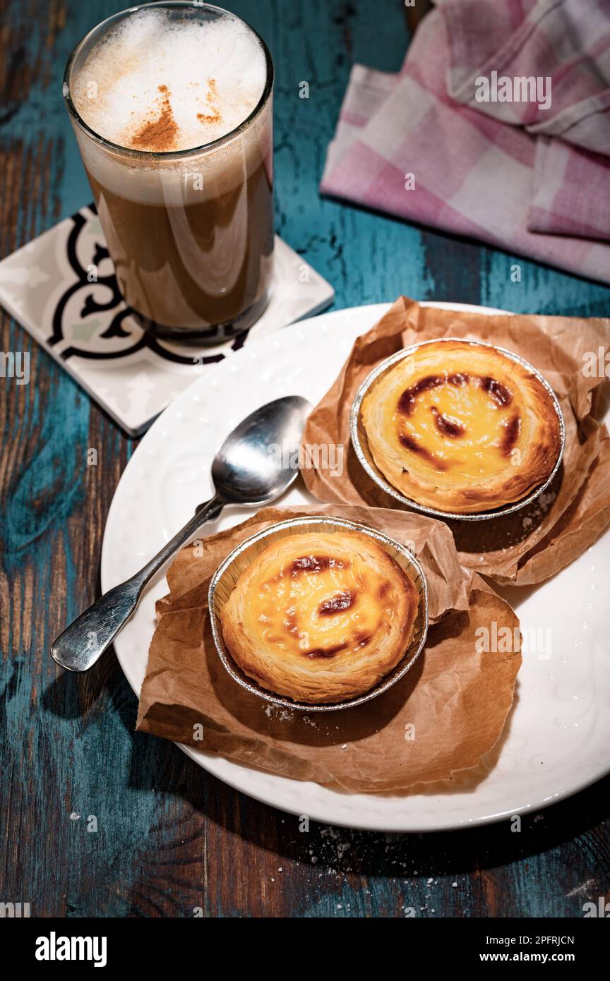 Portuguese pastry Natas with Galao coffee Stock Photo - Alamy