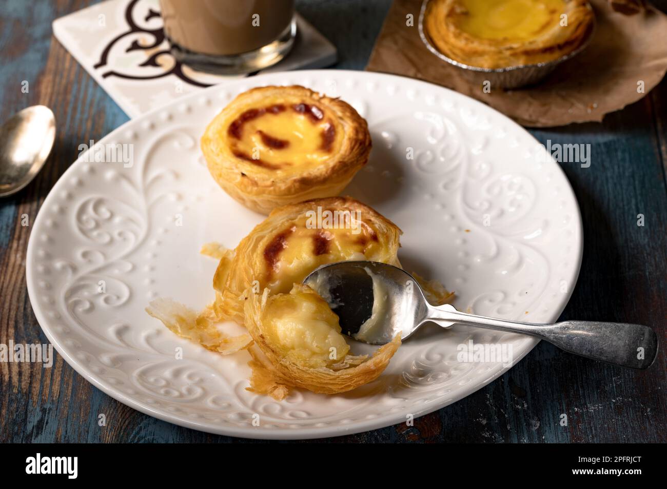 Portuguese pastry Natas with Galao coffee Stock Photo - Alamy