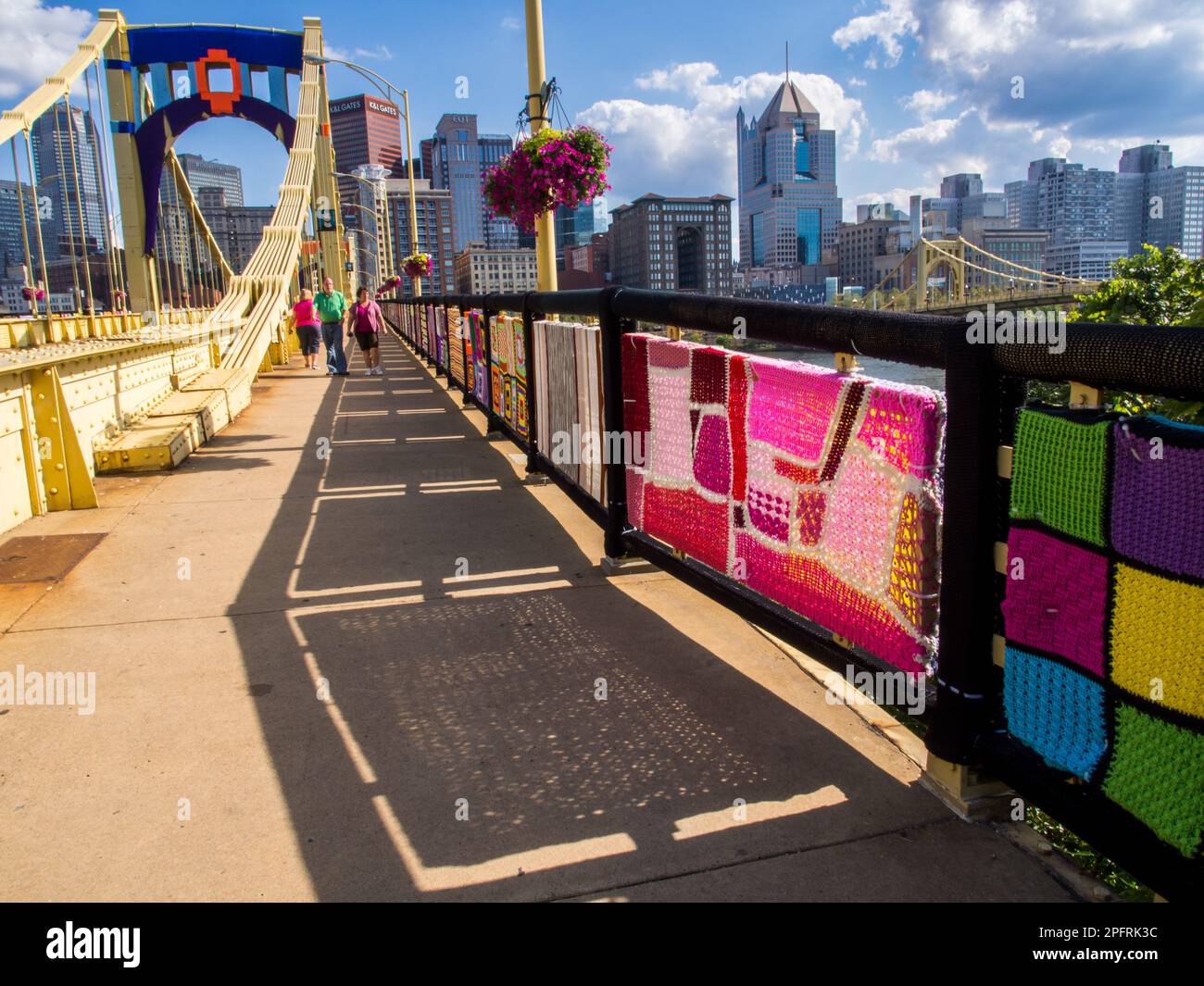 Textile arts on Pittsburgh bridge with people walking across Stock ...