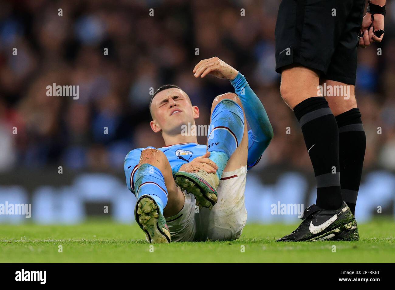 Phil Foden #47 of Manchester City goes down injured during the Emirates ...