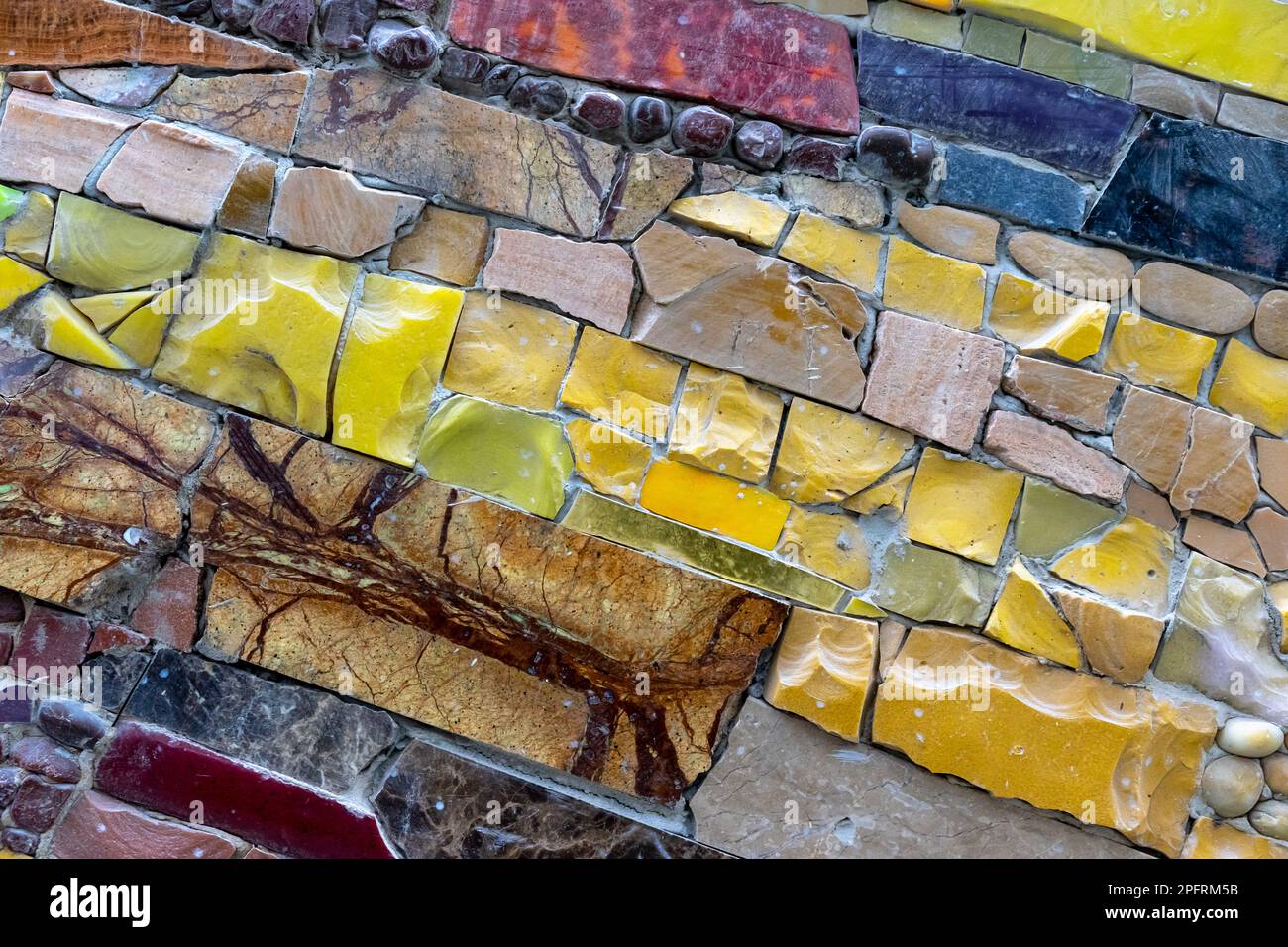 Mosaic of colored tiles and natural stones. Ceramic mosaic background ...