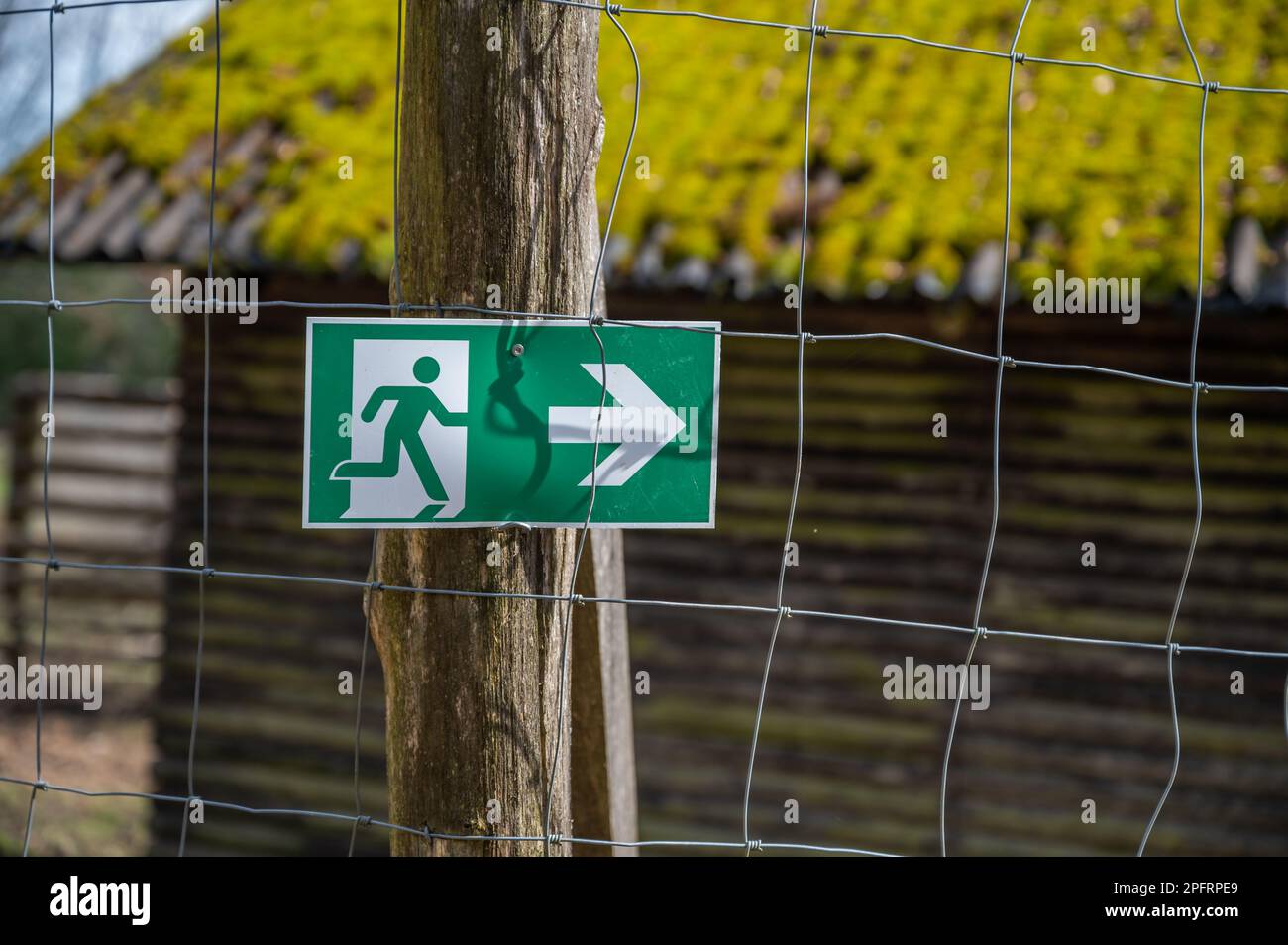 Green Emergency Exit Sign at a Wildlife Park, Amusement Park hanging on ...