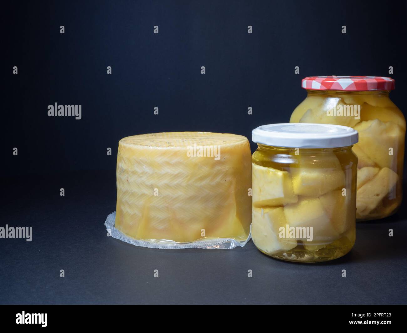Cheese in jars preserved in oil Stock Photo - Alamy
