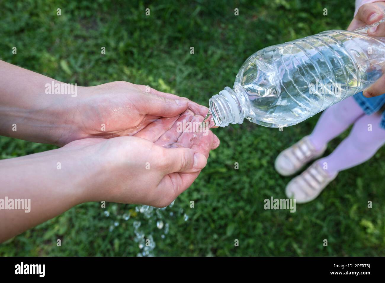 Hands under falling water hi-res stock photography and images - Alamy