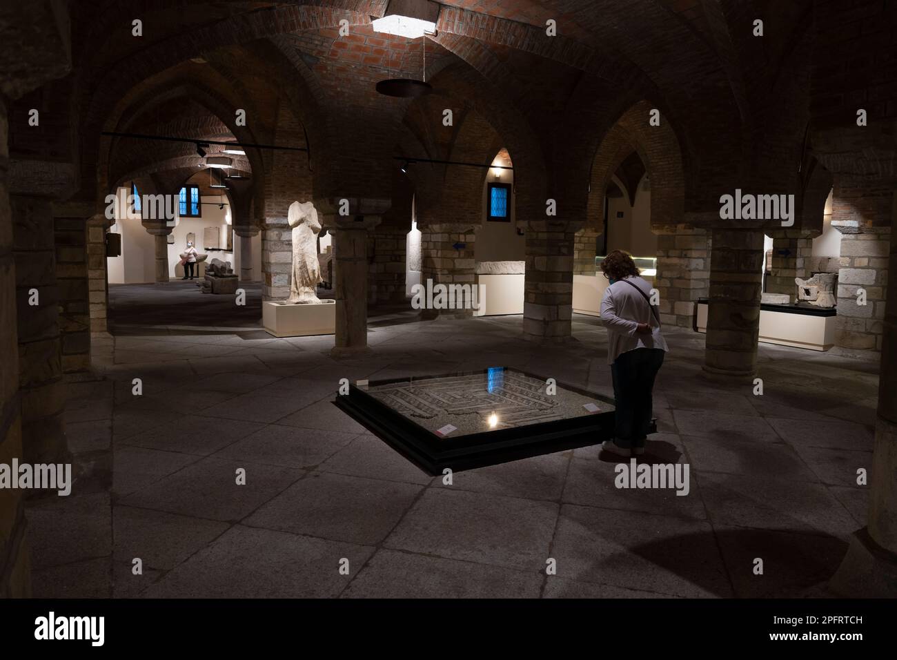 A visitor admires a Roman mosaic on display in the Epigraphic and ...