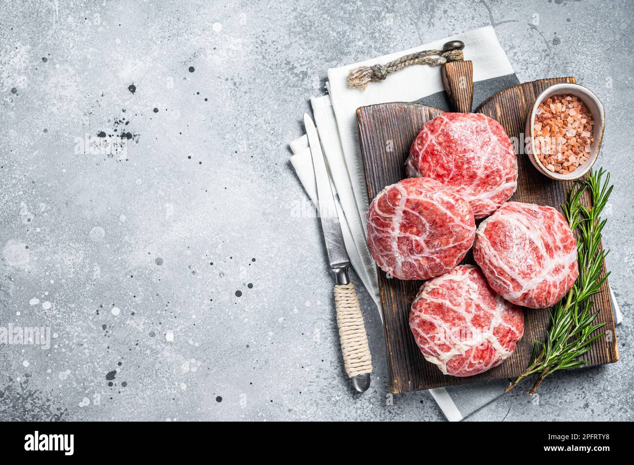Raw Caul Fat Meatballs burger cutlets, fresh meat. Gray background. Top ...