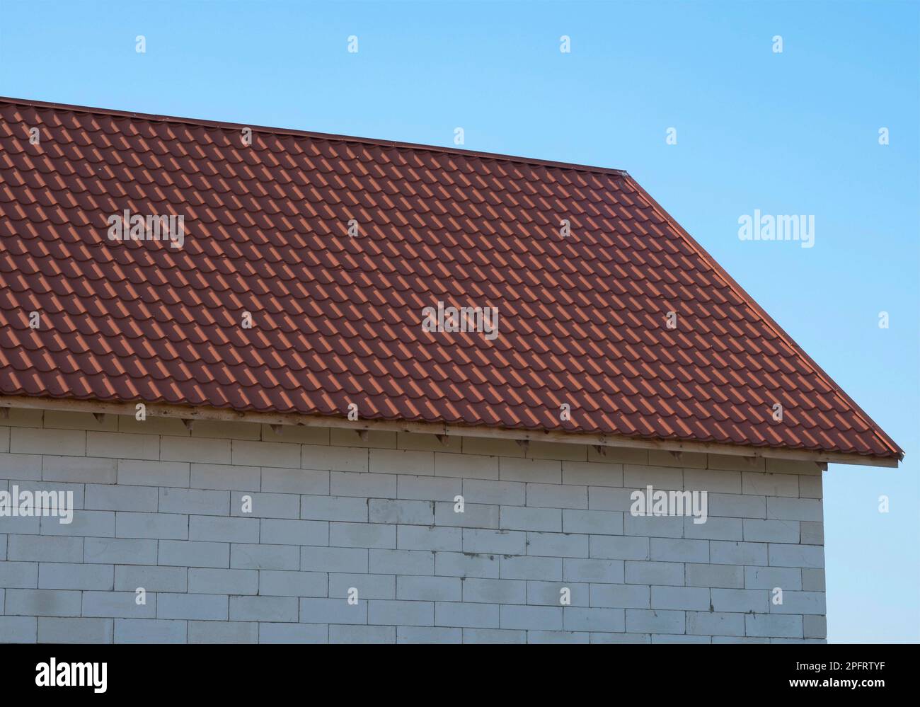 The roof of the house under red shingles Stock Photo - Alamy