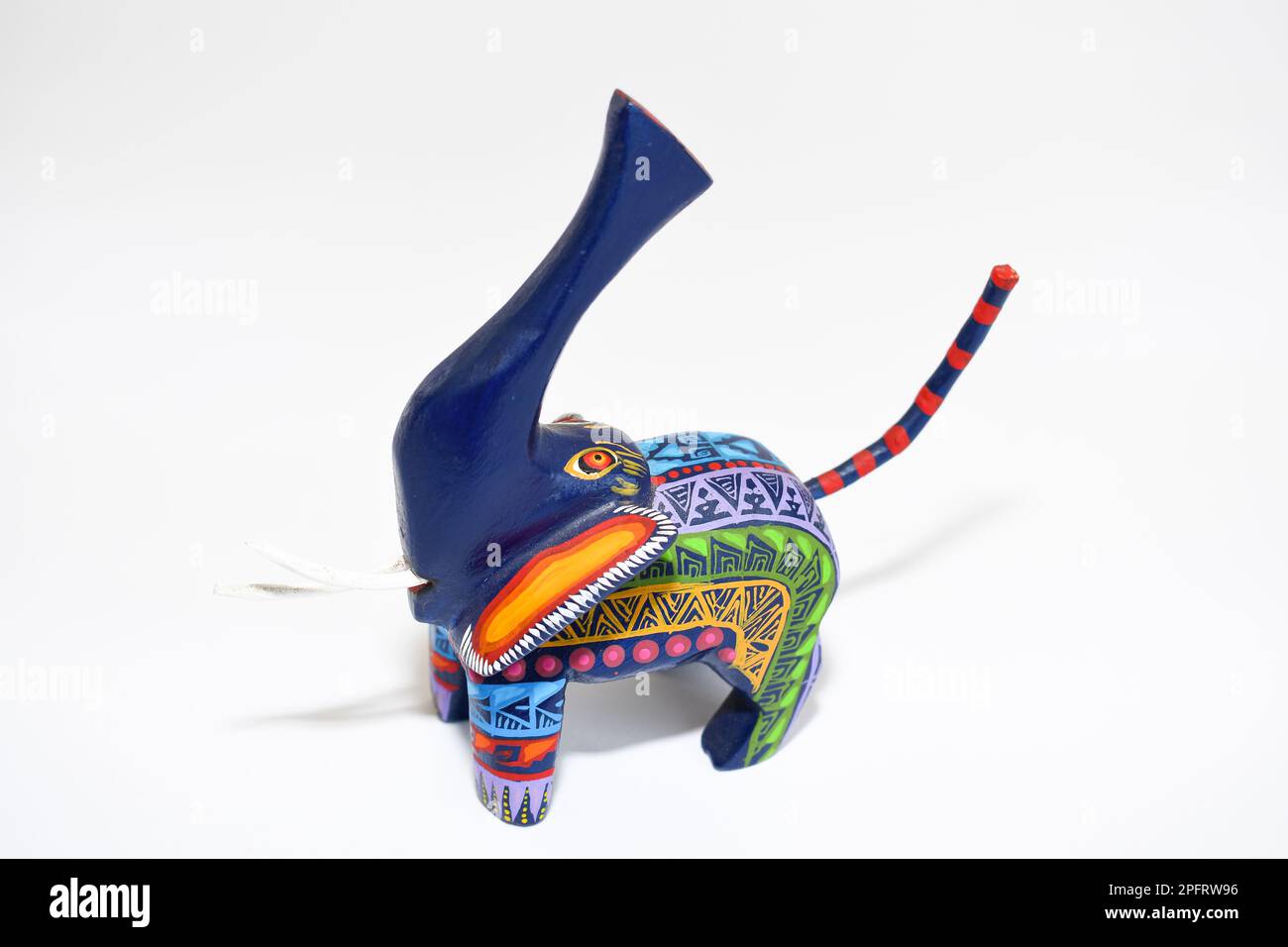 Colorful alebrije. Mexican hand painted wooden handicraft in the shape ...