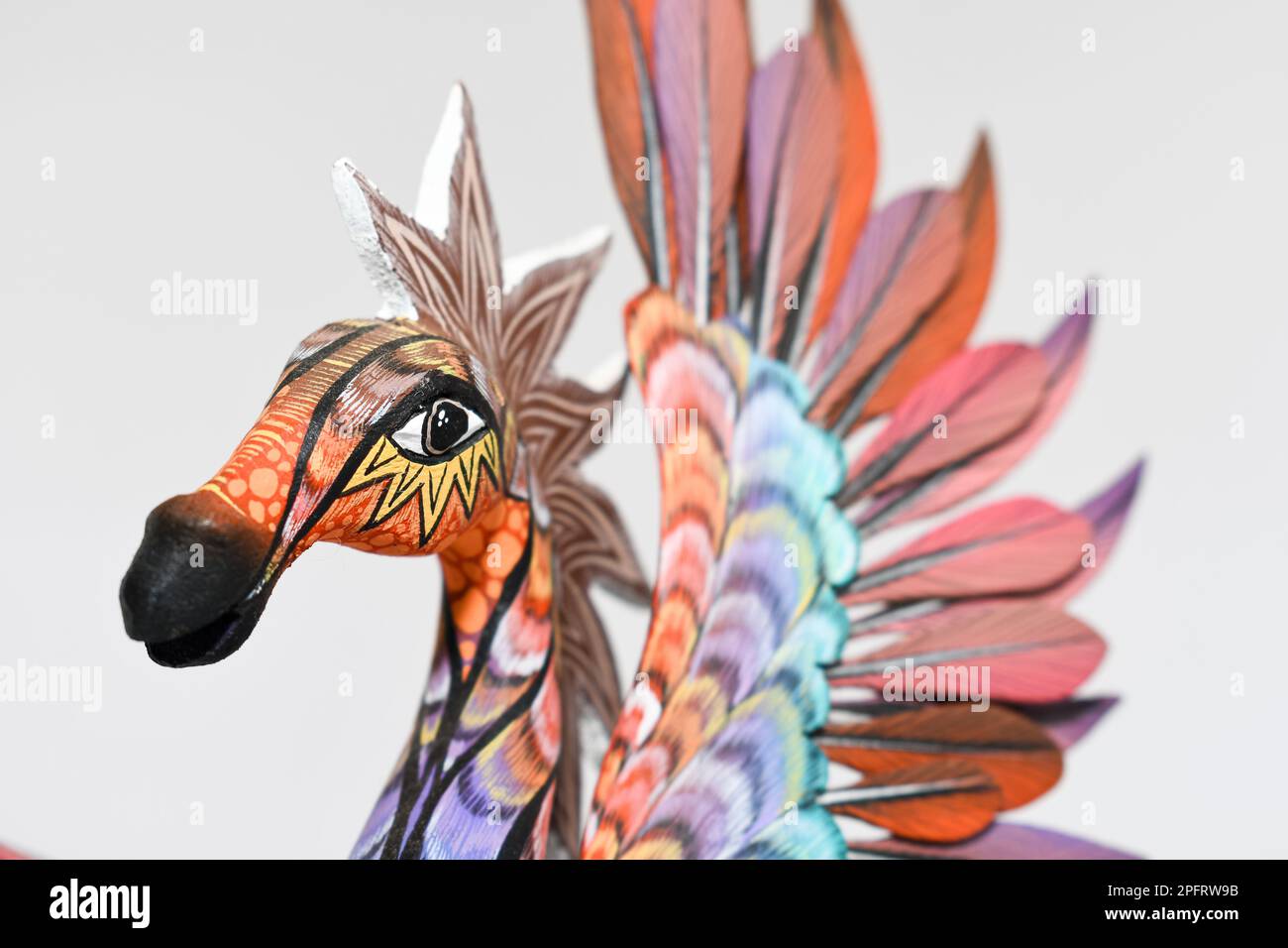 Colorful alebrije. Mexican hand painted wooden handicraft in the shape ...