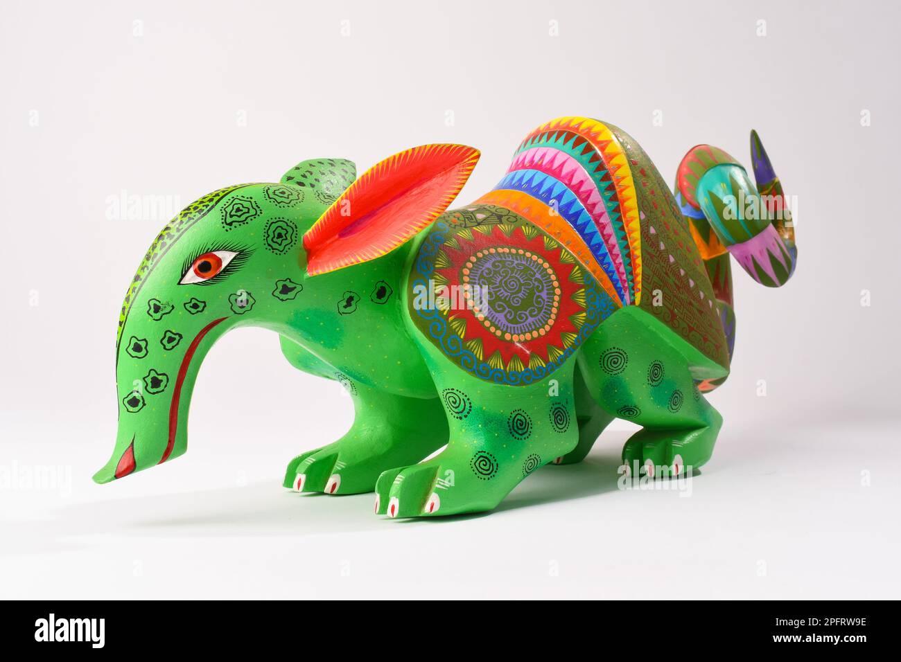 Colorful alebrije. Mexican hand painted wooden craft in the shape of a ...