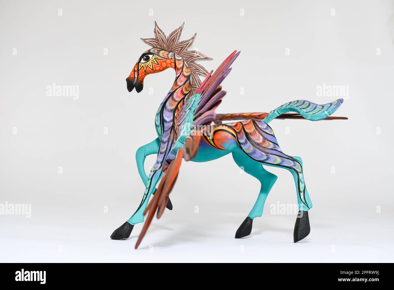 Colorful alebrije. Mexican hand painted wooden handicraft in the shape ...