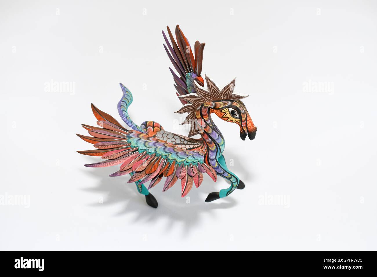 Colorful alebrije. Mexican hand painted wooden handicraft in the shape ...