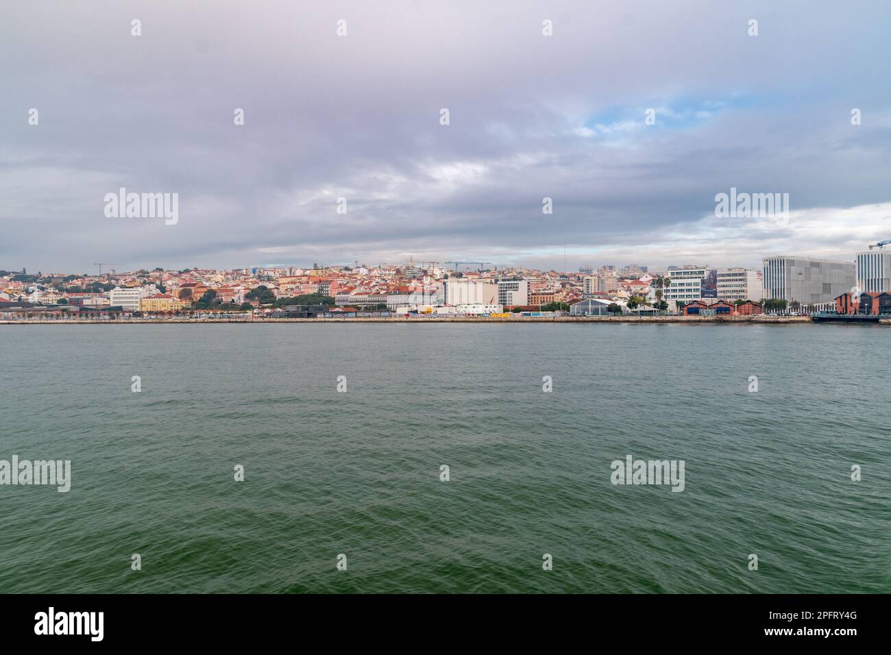 Lisbon, Portugal - December 4, 2022: Panoramic view on Lisbon at cloudy day. View from Tagus ...