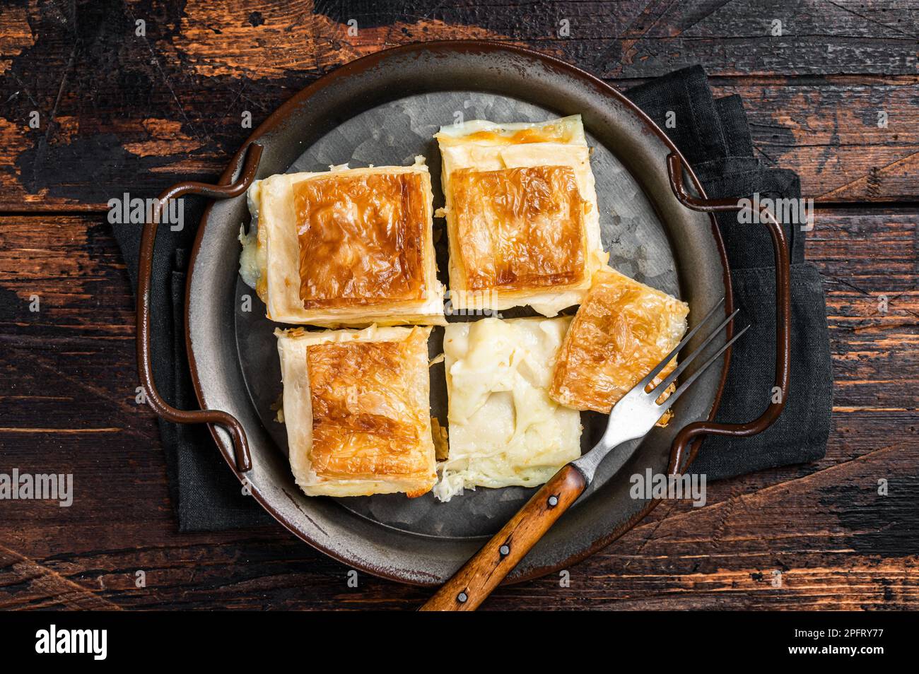 Turkish Su Boregi, Tabla borek or Adana Borek with cheese. Wooden ...