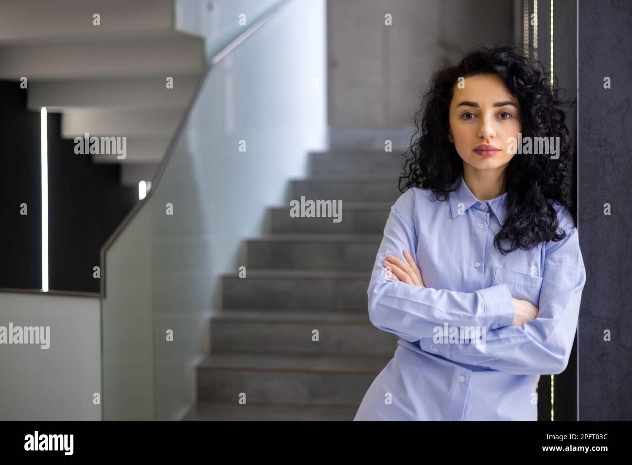 Portrait of serious female boss inside business company office ...