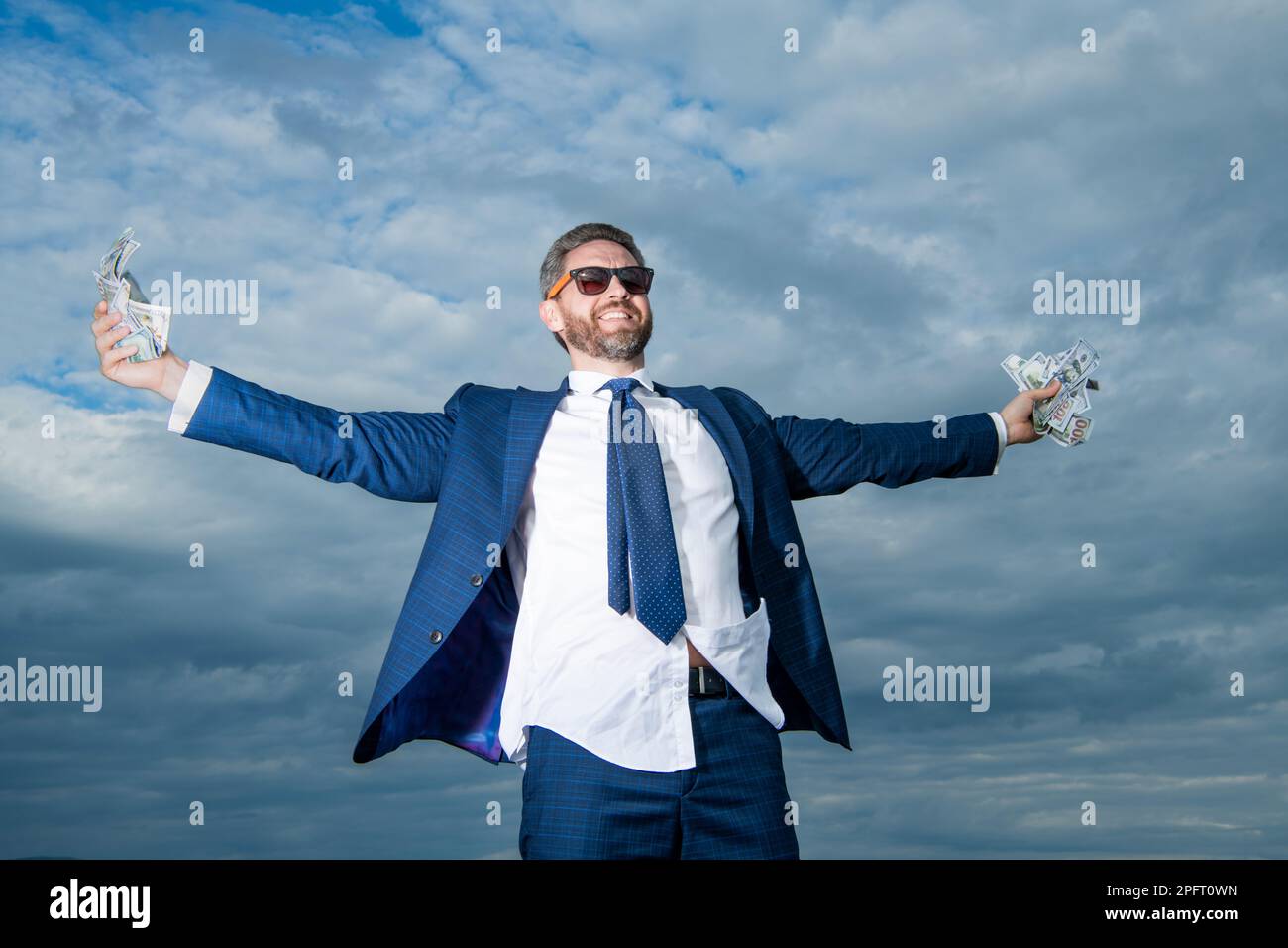 happy millionaire man with money on sky background. millionaire man ...