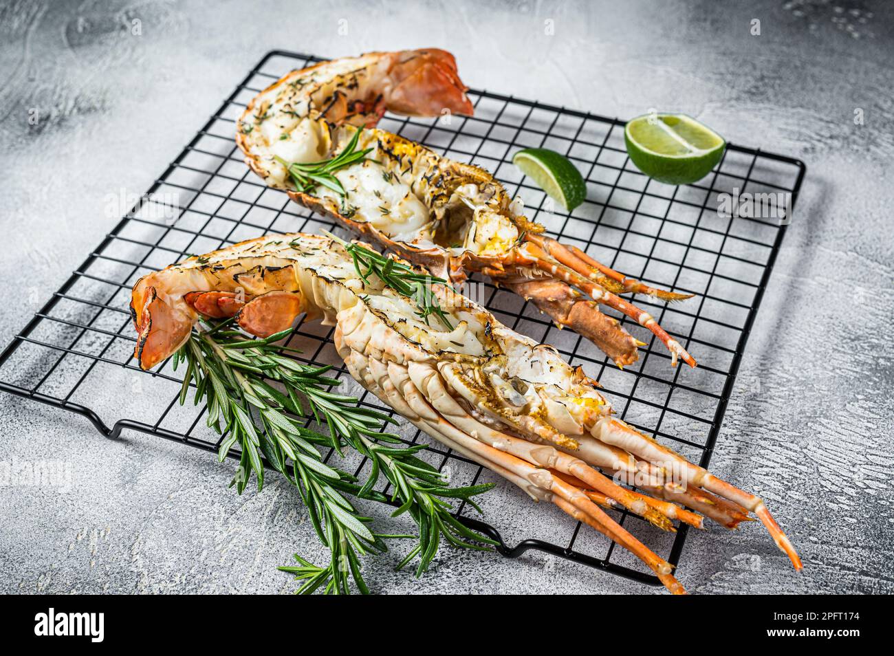 Barbecue grilled and sliced Spiny lobster or sea crayfish with herbs ...
