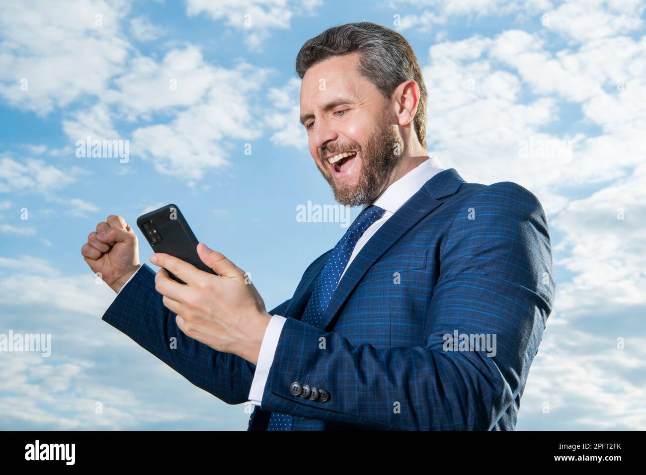 positive businessman type phone message outdoor. businessman type phone ...