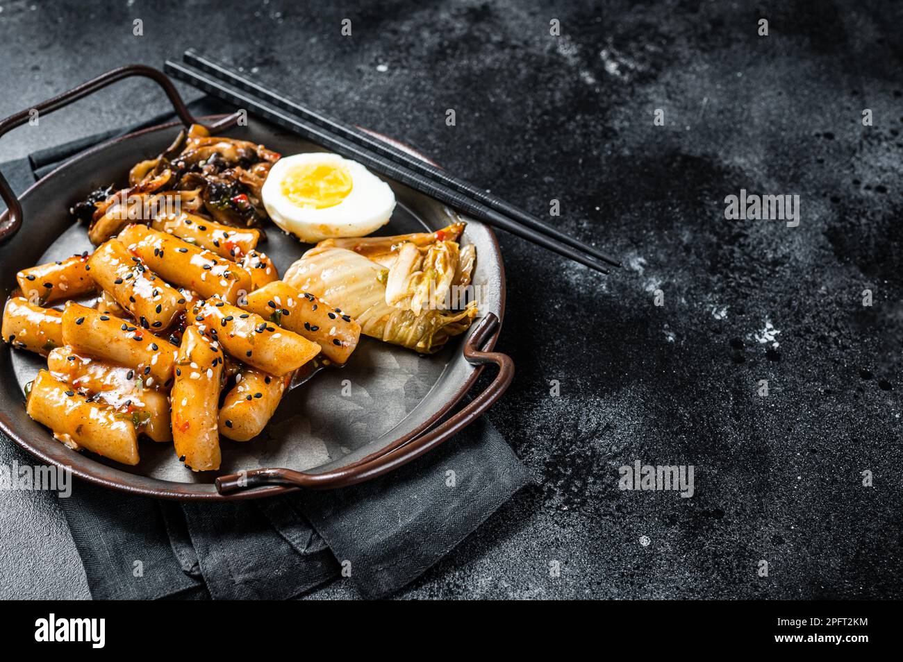 Tteokbokki, Topokki stick rice cake in Hot and spicy sauce with egg and ...