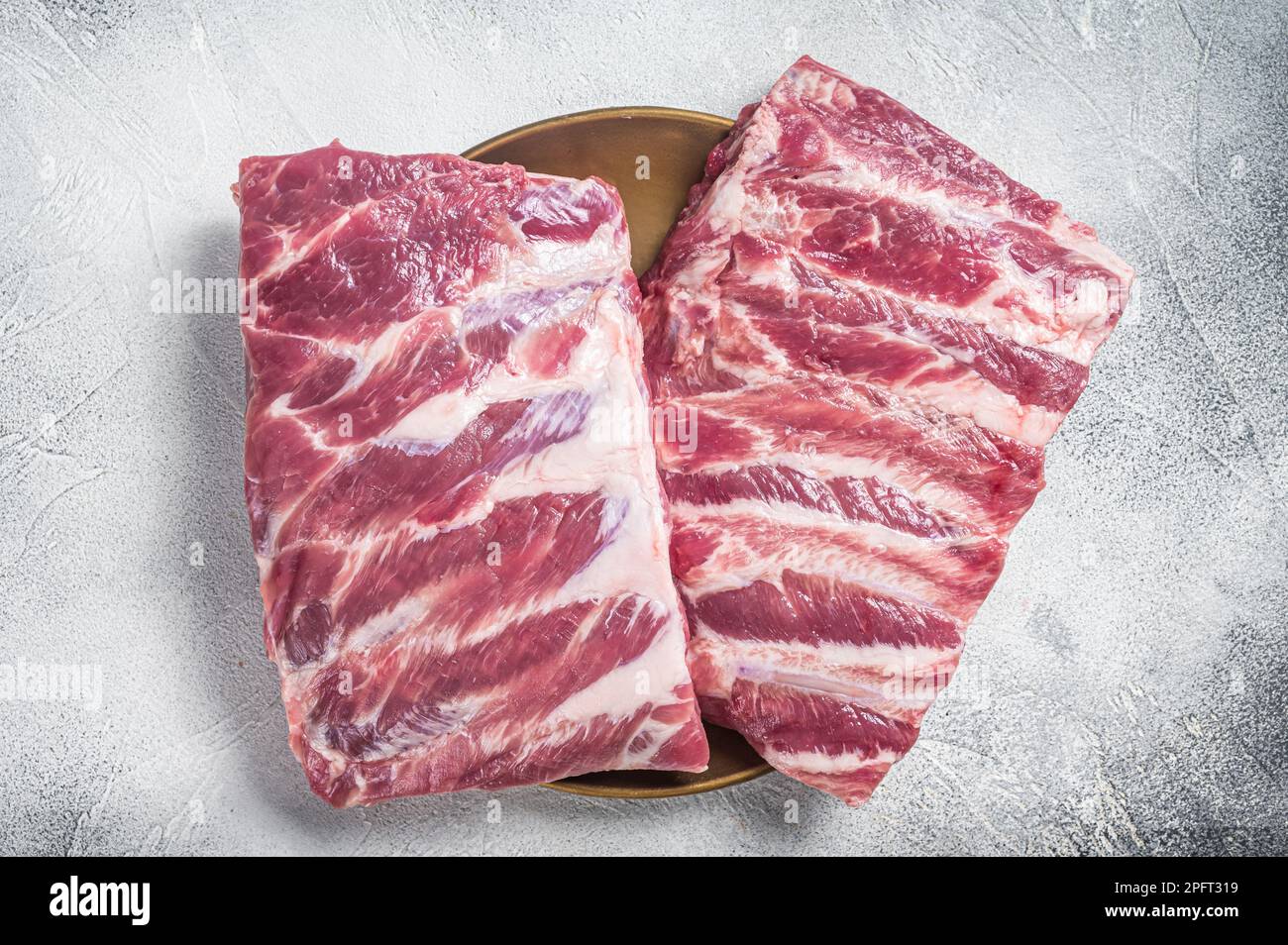 Rack of raw pork spare ribs. White background. Top view Stock Photo - Alamy
