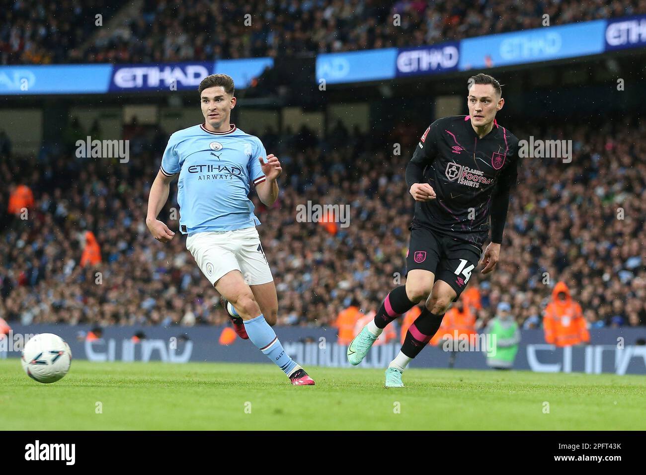 Manchester, UK. 18th Mar, 2023. Connor Roberts of Burnley (r) passes ...