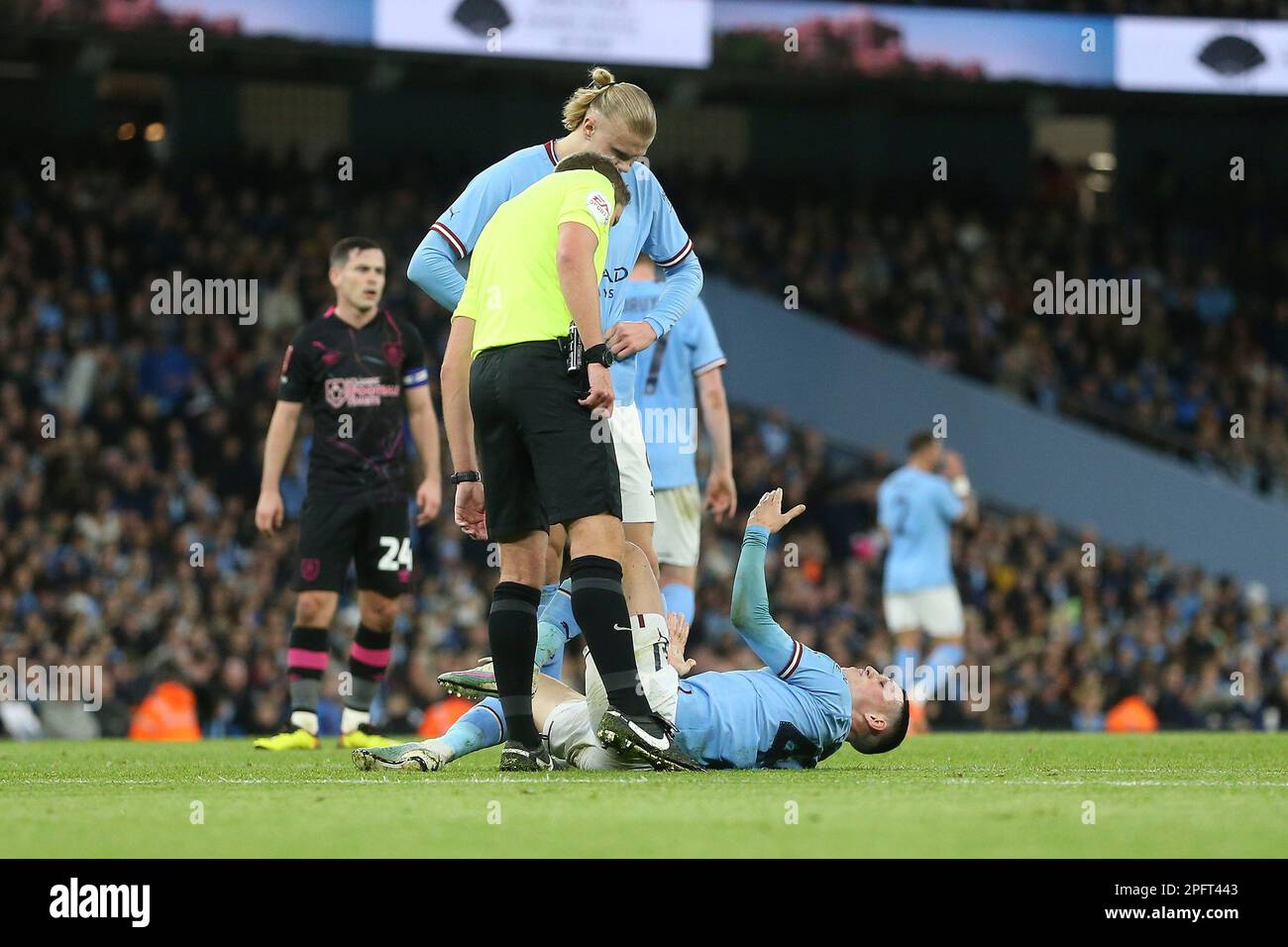 Manchester, UK. 18th Mar, 2023. Phil Foden of Manchester City lies on ...