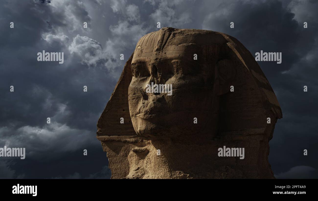 Sphinx head and dark storm clouds Stock Photo - Alamy