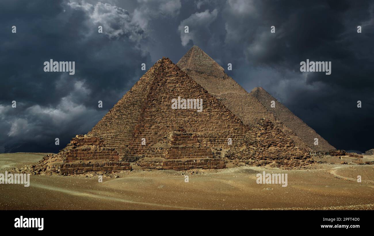 Great pyramids and storm clouds Stock Photo - Alamy