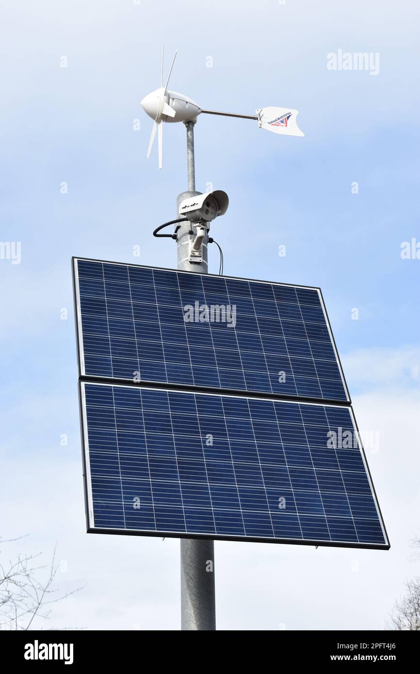 A surveillance camera in a car park powered by solar and wind power ...