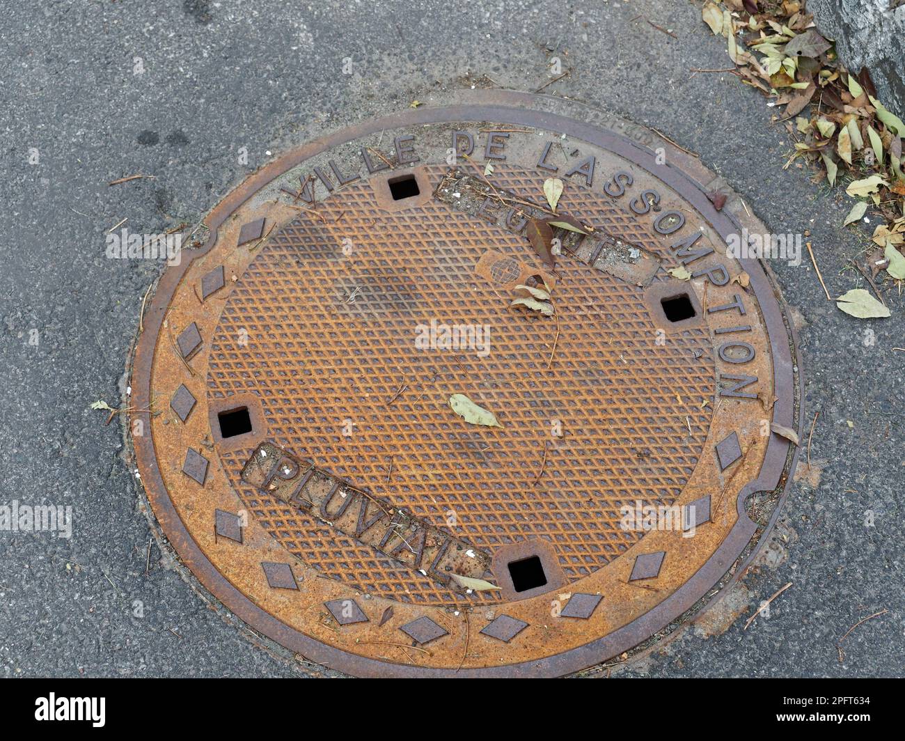 Metal manhole cover. Quebec,Canada Stock Photo - Alamy