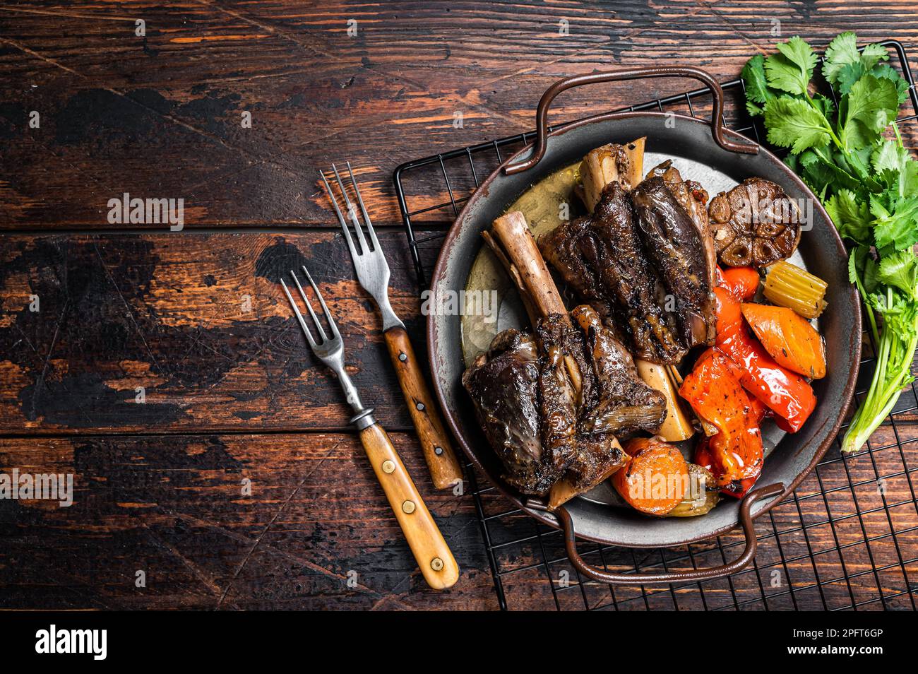 Homemade Braised Lamb Shanks with Sauce and Herbs in a steel tray ...