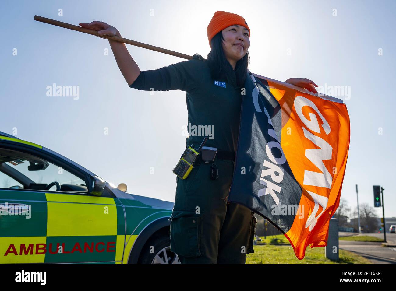 BRISTOL, ENGLAND - FEBRUARY 06: A paramedic holds a GMB Union flag on ...