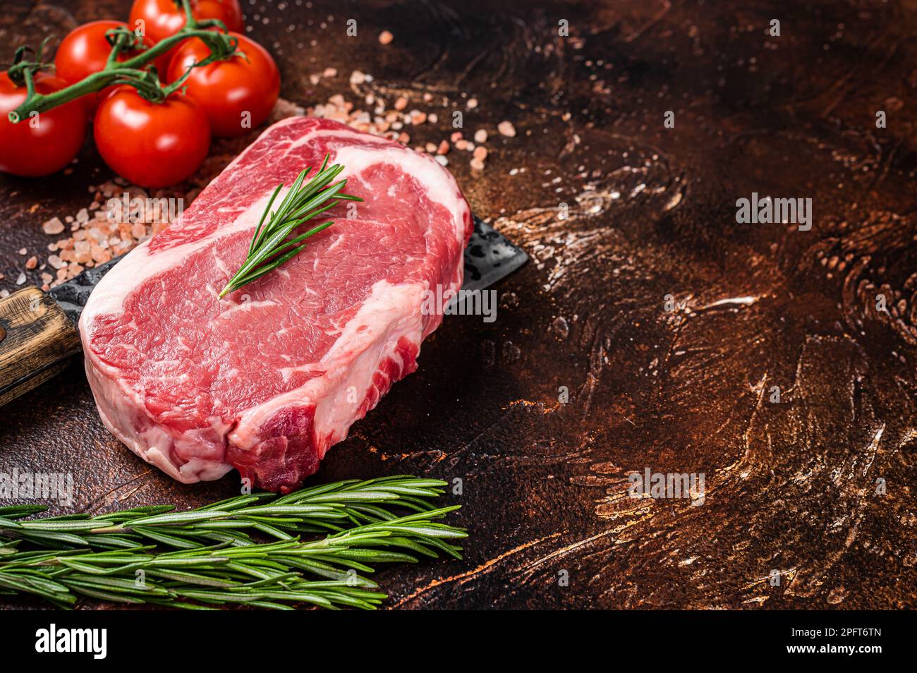 Uncooked raw Rib eye Steak, ribeye beef meat on butcher cleaver with ...