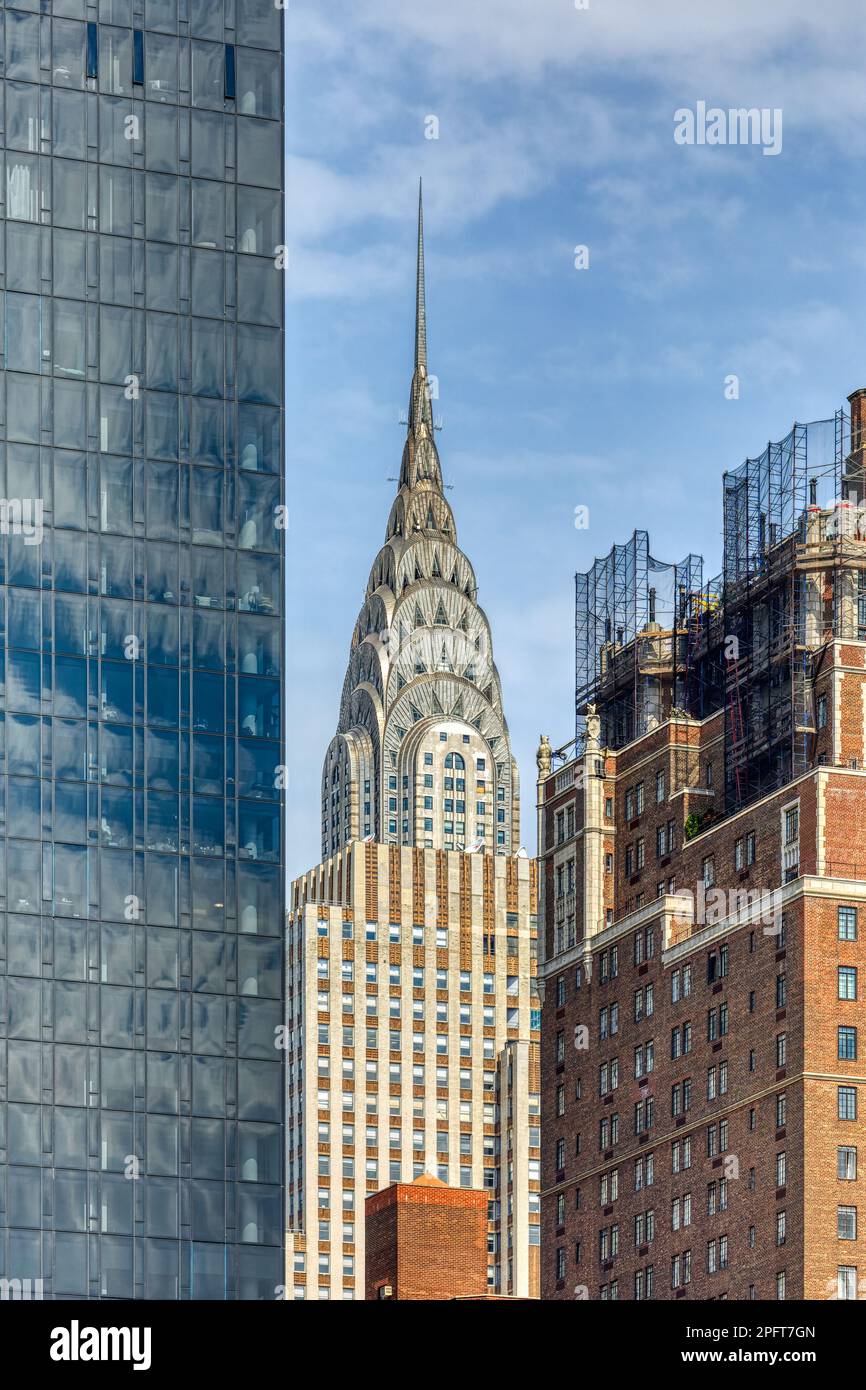 The Chrysler Building’s iconic spire, framed by black glass of 685 ...