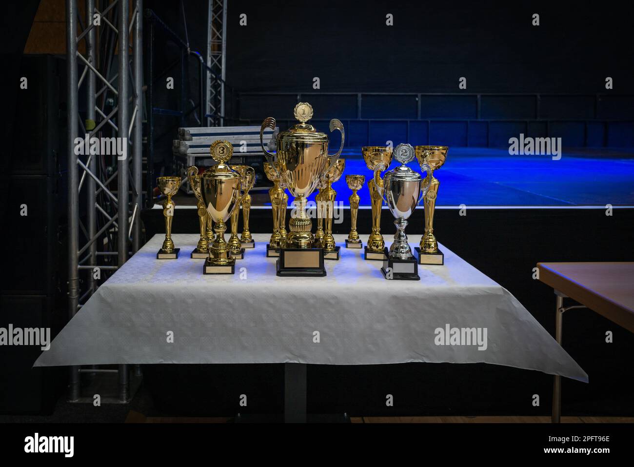 various cups are placed on a table next to the stage Stock Photo - Alamy