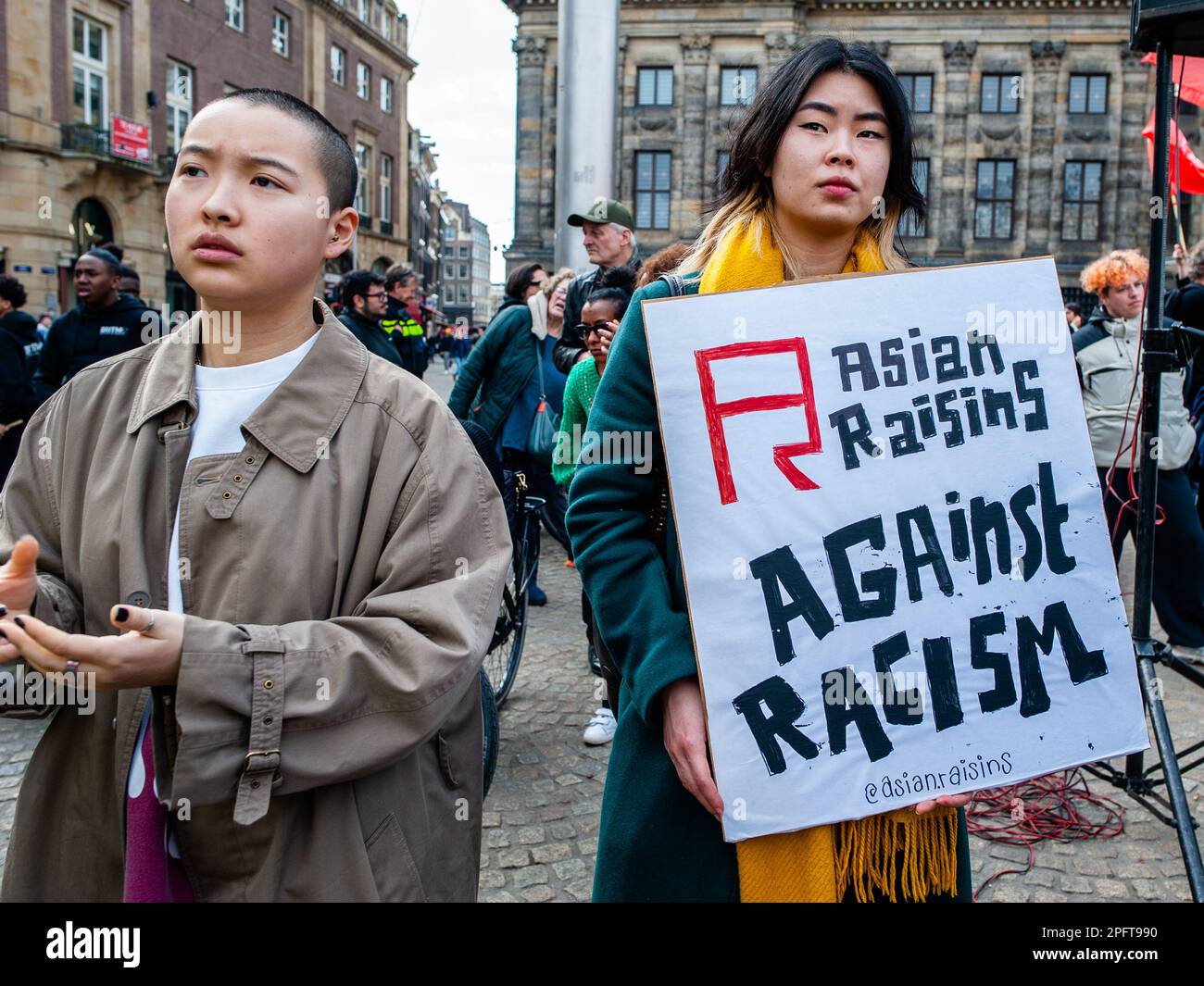 Amsterdam, Netherlands. 18th Mar, 2023. An Asian woman is seen holding ...
