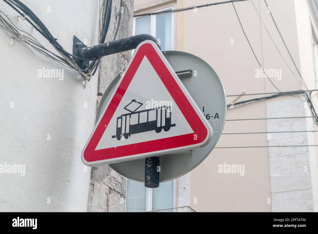 Triangular red and white warning sign of a tram Stock Photo - Alamy