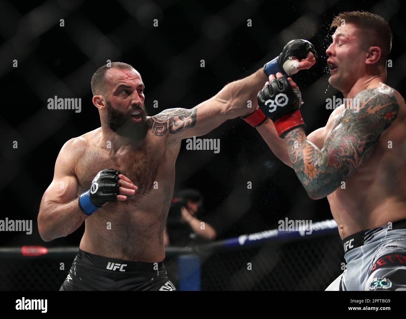 Roman Dolidze (left) in action against Marvin Vettori in their ...