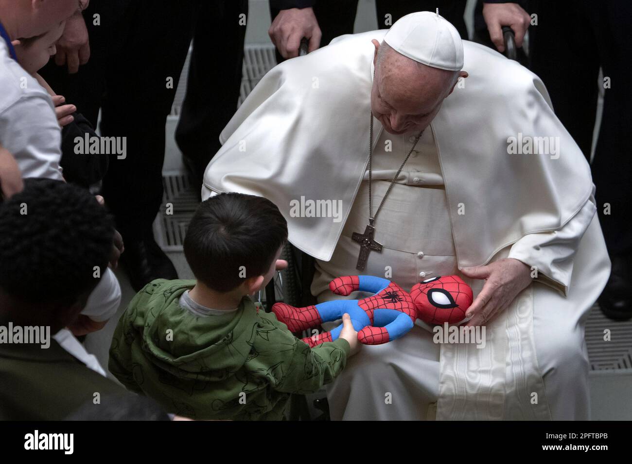Vatican City, vatican, 18 March 2023. A child gives a spider-man toy to ...